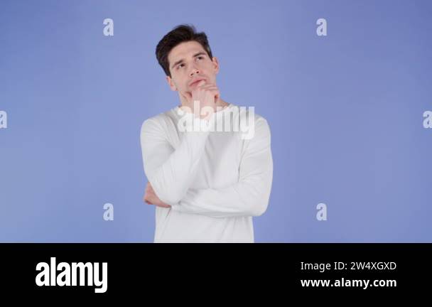 Young thinking pondering man having idea moment pointing finger up on ...