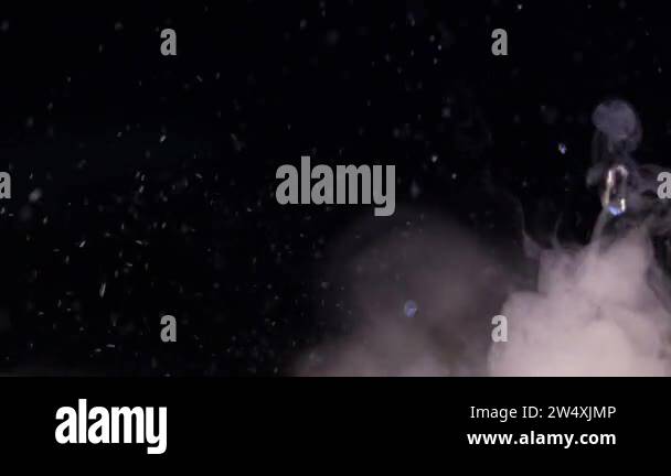 Chemical reaction with boiling swirling water splashes, jumping drops ...