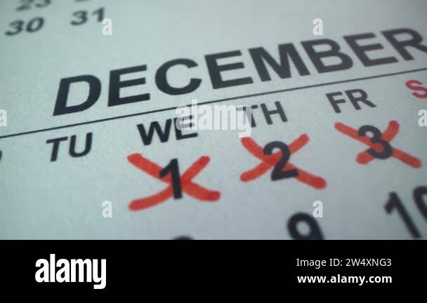 The woman crossed out the december 2021 calendar date with a red marker ...