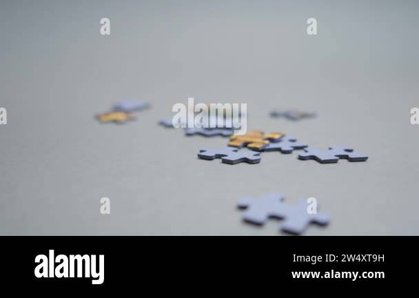 Close Up Jigsaw Puzzle Pieces Falling Down on Grey Background. Falling ...