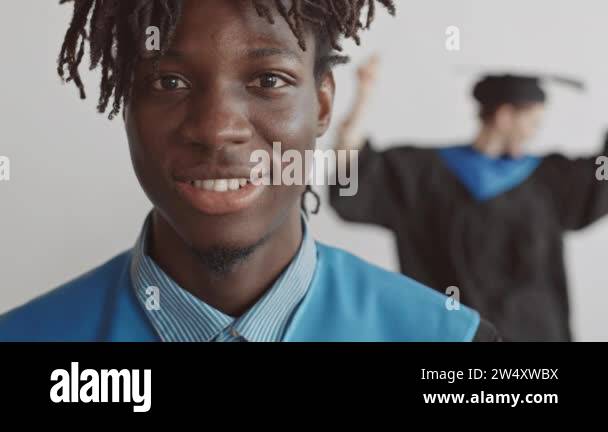 Close-up portrait of young male African-American graduate student ...
