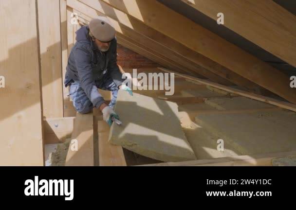 Construction work. Installation of insulation using Stock Video Footage ...