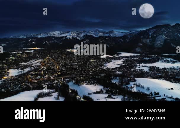 Mountain winter landscape, night aerial view. Magical mountain city ...