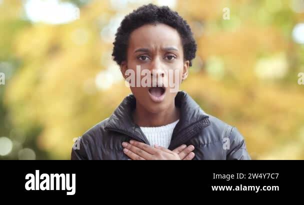 Sad dark skinned black woman looks with pleading expression asks to ...