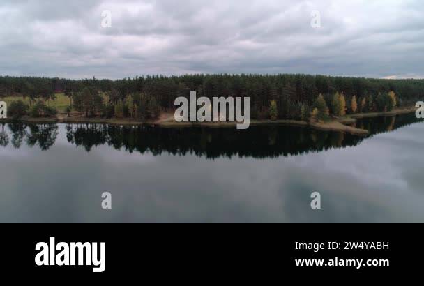An overhead shot wilderness area artificial lake with mirror surface of ...