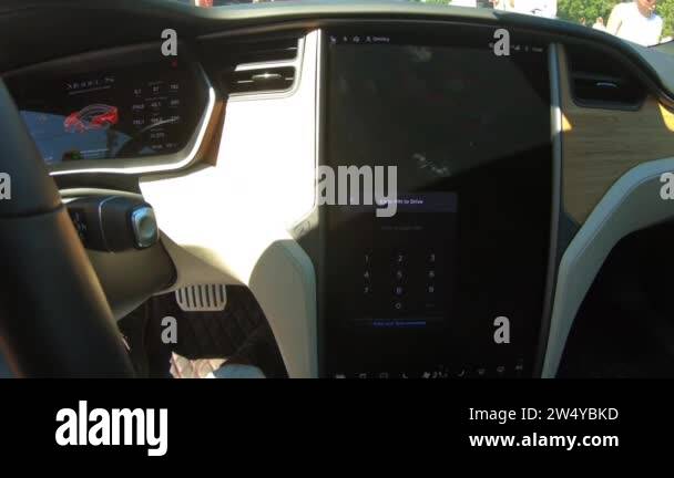 A TESLA electric car. The touch panel inside the Tesla car . A high ...
