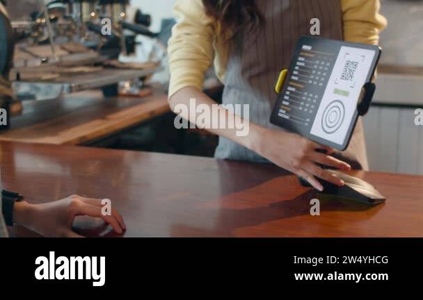 Young Asia female self service use mobile phone pay contactless with ...