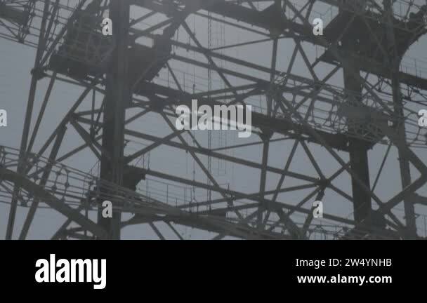 Chernobyl, close tilt up a backlit section of the Duga-1 radar station ...