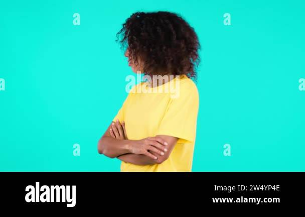 Angry offended african woman keeping arms crossed and staring at camera ...