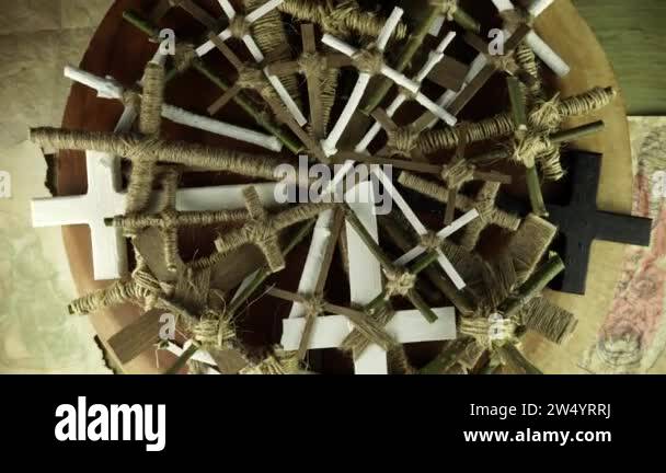 Different wooden crucifix or cross on the table. Handmade religion ...