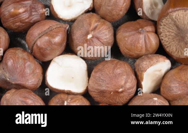 A close-up of hazelnuts. Lots of nuts. Whole kernels and halves. Peeled ...