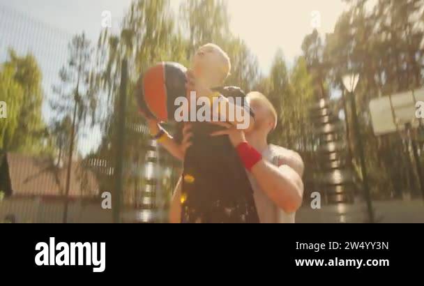 Basketball players sport happy family father and son training with ball ...
