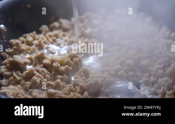Preparation of traditional bechamel for homemade meat croquettes: milk ...