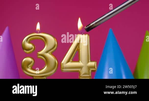 Burning birthday cake candle number 34. Happy Birthday background ...