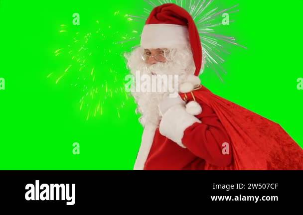 Santa Claus sends a kiss and wave, against holiday fireworks, Green ...