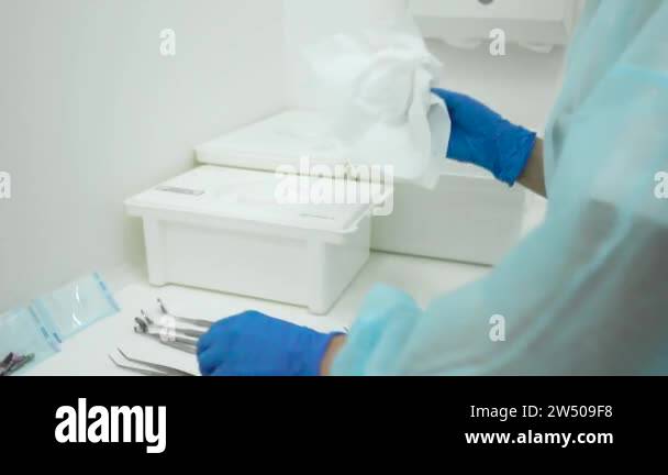 Medical worker preparing cleaning disinfecting medical tools in ...