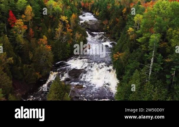 Beautiful panning down aerial looking down the Potato River to Upper ...