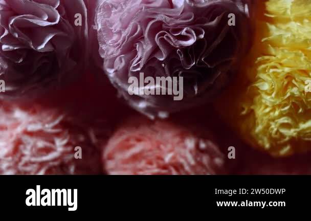 Close up of handmade colorful paper flowers, event preparation. Special ...