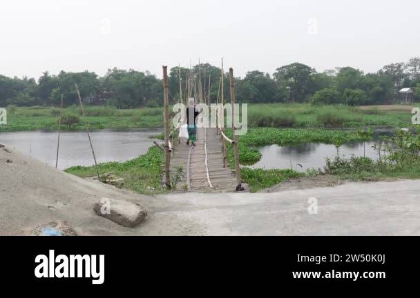 Bangladesh May 02, 2021: A primitive bamboo bridge has been built over ...