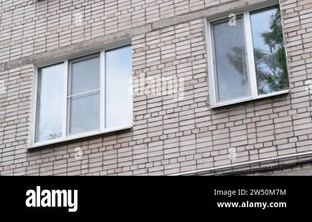Close up two glazed Windows of soviet union residential building ...