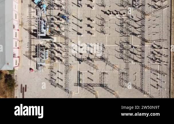 Transformer electrical power plant top down aerial view footage. High ...