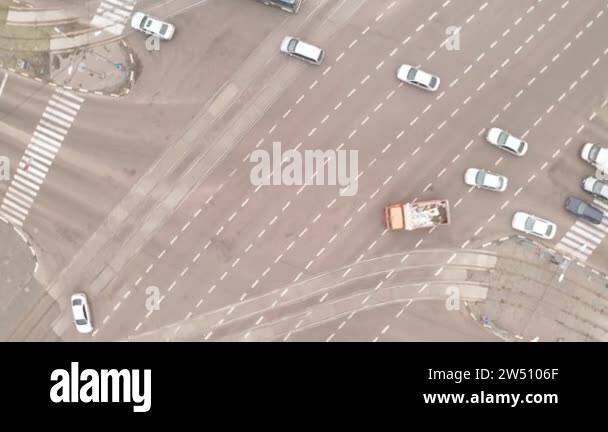 Cars pass a multi-lane complex intersection with traffic lights - drone ...