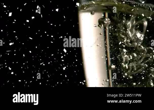 Animation of confetti falling and bubbles rising in glass of champagne ...