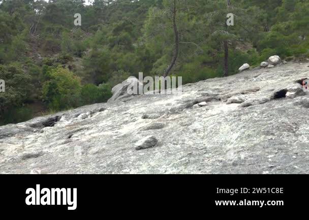 Flame of Methane Underground Emerges From Crack Between Rocks and Burns ...