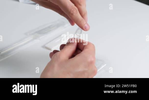 Process of taking rapid antigen self test with nasal swab, pouring ...