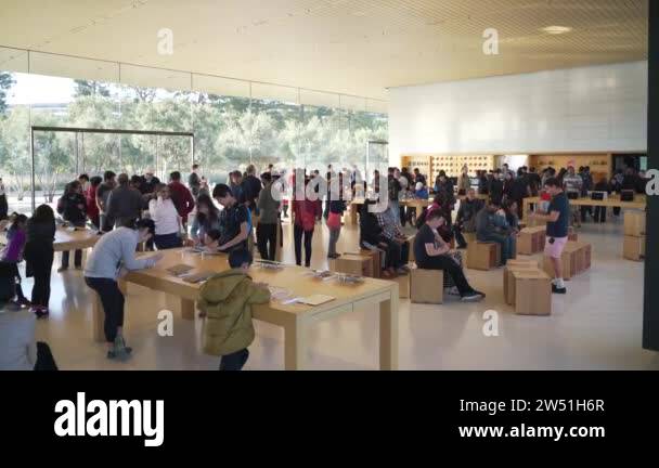inside Apple Store Visitor Center with many customers in the new Apple store and Headquarters of ...