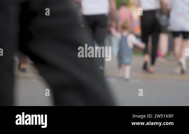 Anonymous crowd of pedestrians walking crossing street a busy city ...