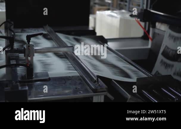 Machinery shop. Punching machine. Die cutting of paper or carton ...