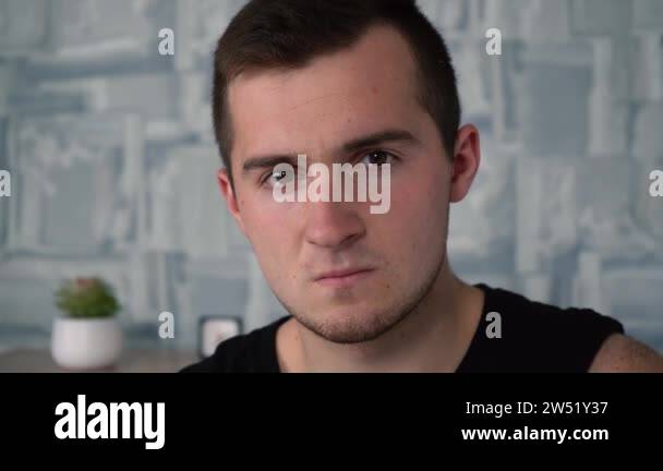 man changes the emotions of his face from evil to good Stock Video ...