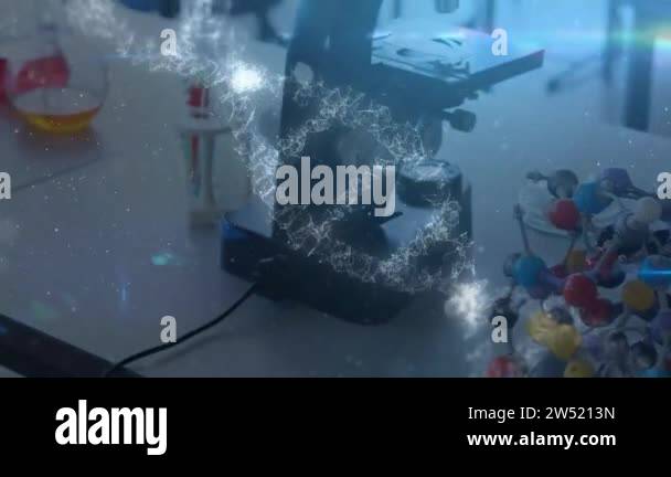 Animation of DNA strand spinning over empty school chemistry laboratory ...