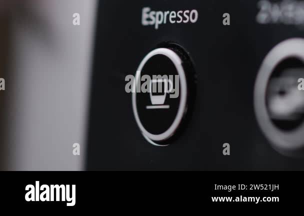 Close up Barista selects an espresso for making coffee presses button ...