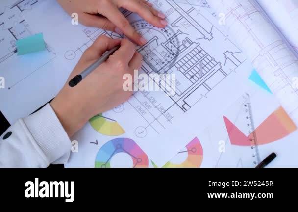 Hands use pencil with a protractor. Architectural Project drawings with ...