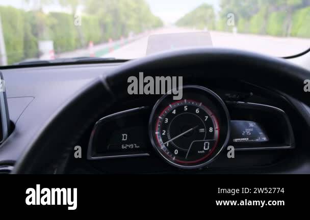Slow footage of man driving. Closeup of car dashboard, console ...
