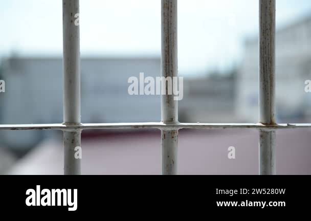 A typical landscape from the window of the prison behind bars in a ...