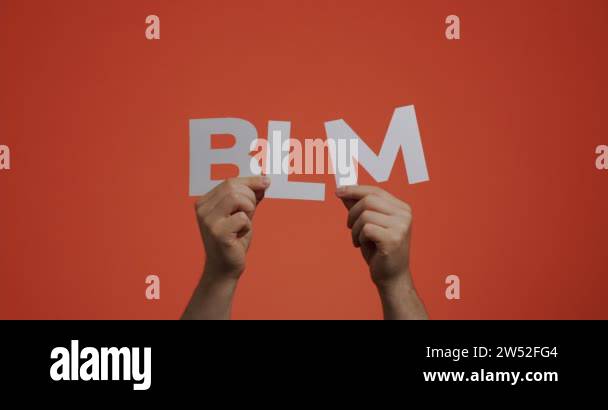 Black lives matter slogan. Hands raising up showing BLM letters made of ...