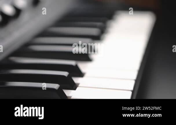 Professional synthesizer keyboard. Digital piano keys filmed in close ...