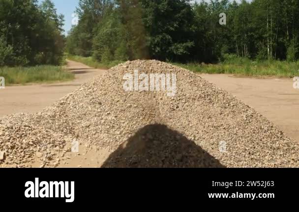 Video shot of production of crushed stone used as concrete filler at ...
