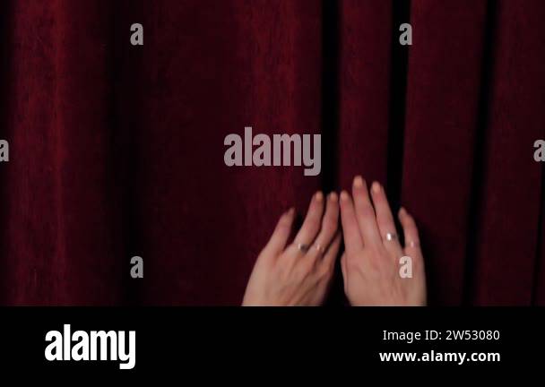 Female hands opening red velvet curtains. Green screen behind. Chroma ...