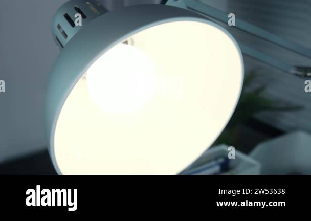 Female hands turning off the light and then removing, changing ...