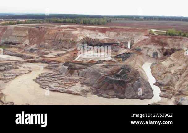 Opencast mining quarry with lots of machinery. Iron ore quarry from ...