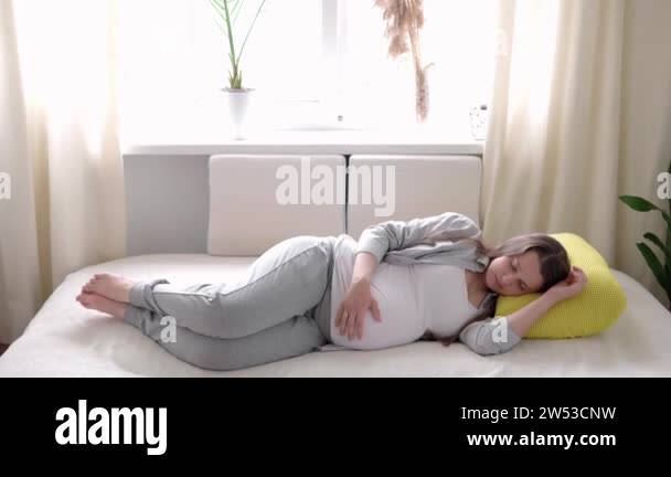 pregnancy, motherhood, people, expectation concept - happy tired sleepy ...