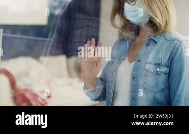 Little girl visiting grandparents through window. Shot with RED helium ...