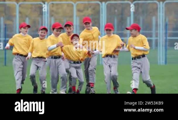 Baseball at school, a team of boys baseball players in yellow uniforms ...