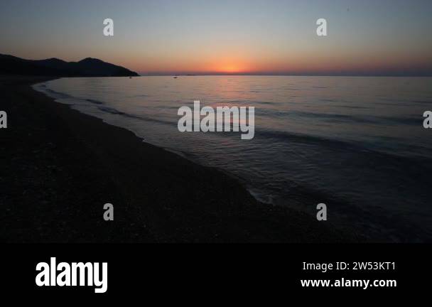 Dawn over beach Stock Videos & Footage - HD and 4K Video Clips - Alamy