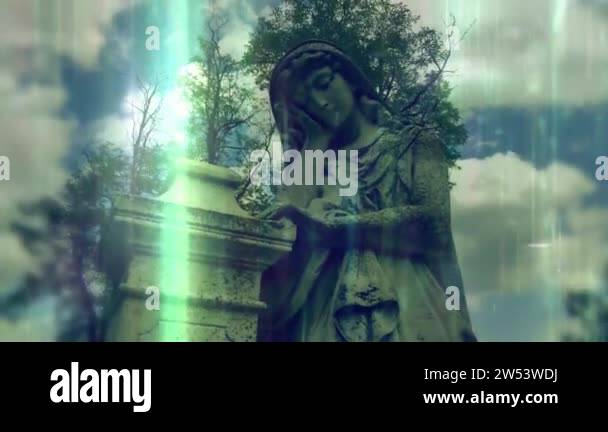 Figure of a praying angel. A very ancient stone statue. . Sad angel as ...