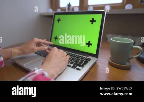 Woman hands typing and scrolling on a trackpad in a laptop computer ...